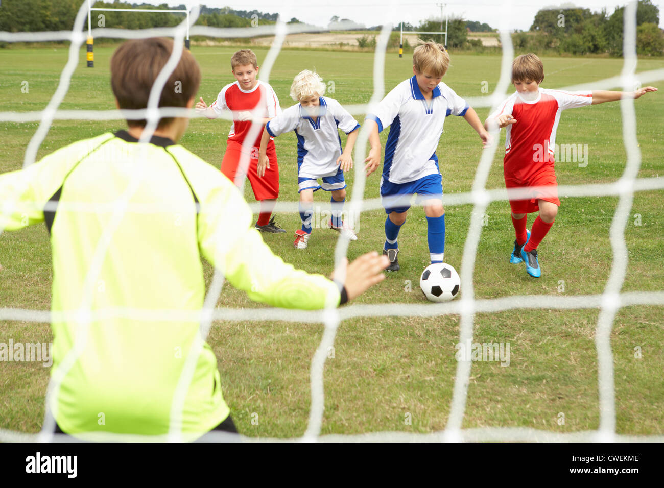 Player ready to score goal in Junior 5 a side Stock Photo - Alamy