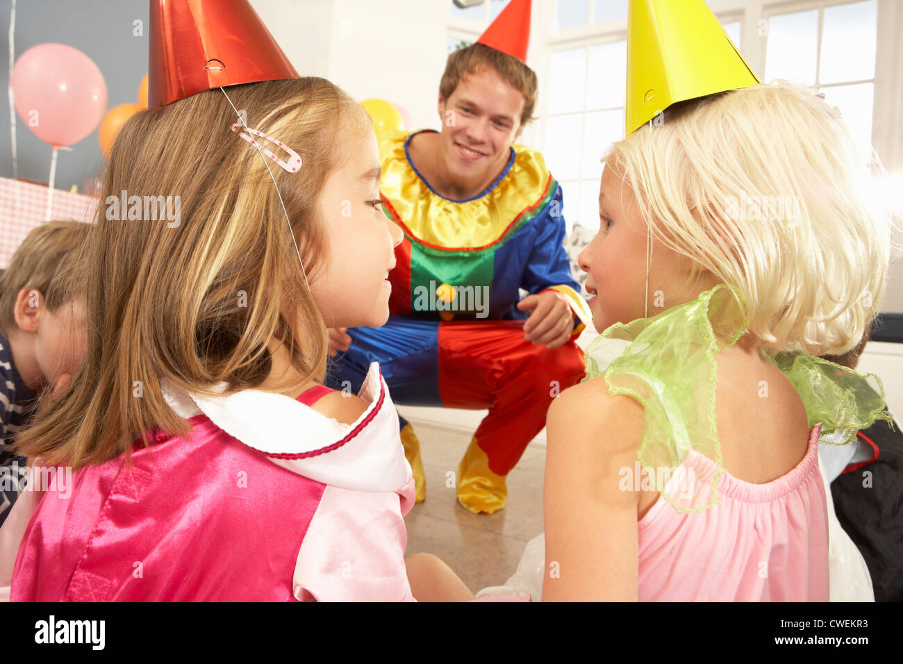 Clown entertaining children at party Stock Photo - Alamy