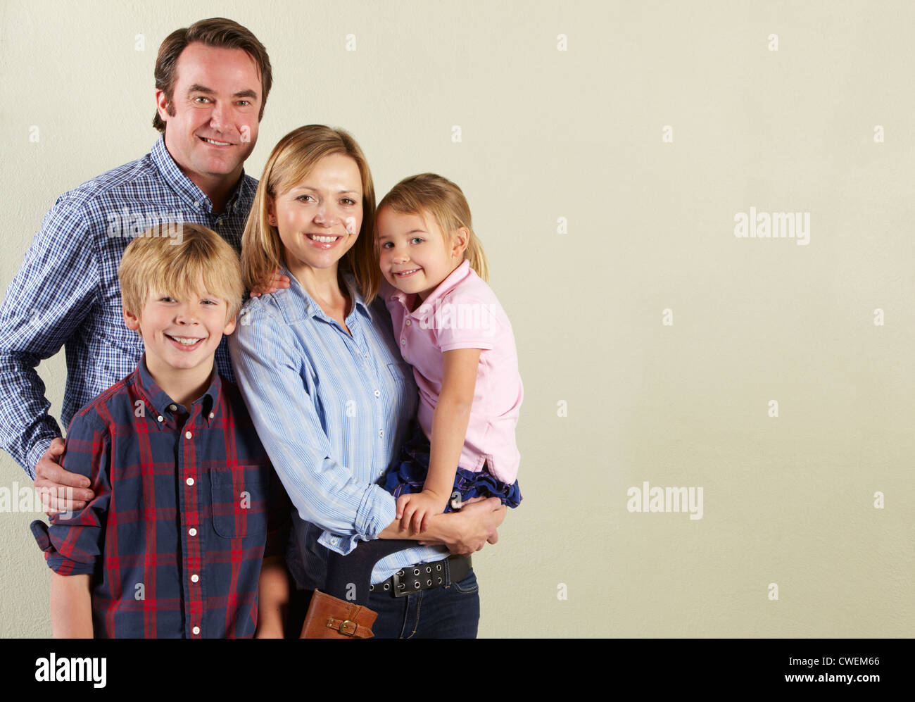 Studio Shot Of Relaxed Family Stock Photo - Alamy