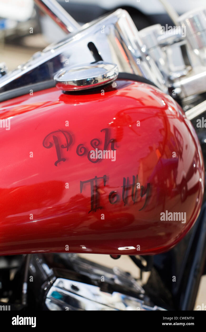 Customized Motor bike fuel tank red with posh Totty on it Stock Photo ...