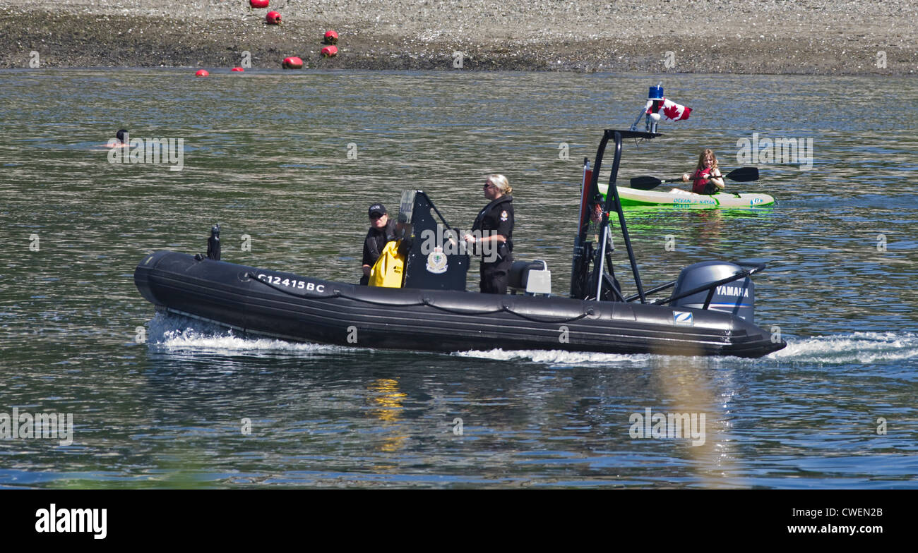 Vancouver police boat patrolling False Creek and English bay with two ...