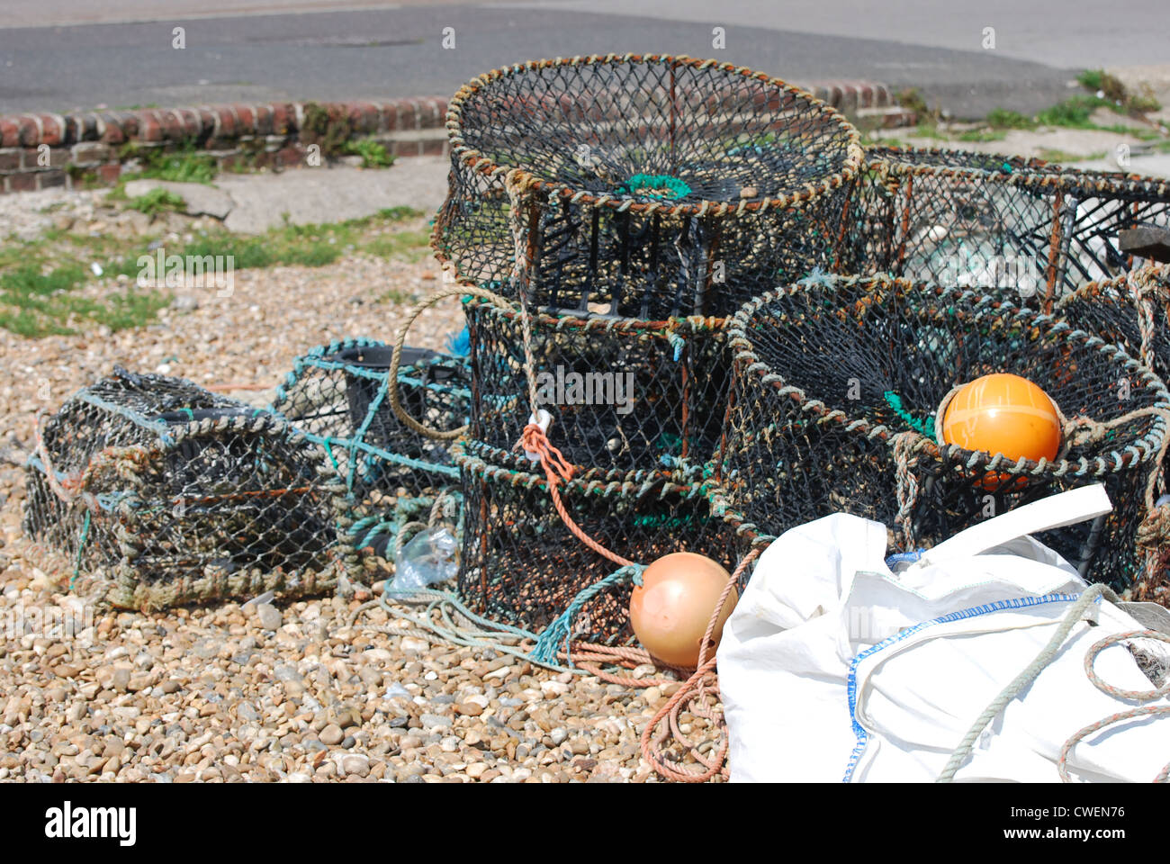 selection of fishing nets on a cobble beach Stock Photo - Alamy