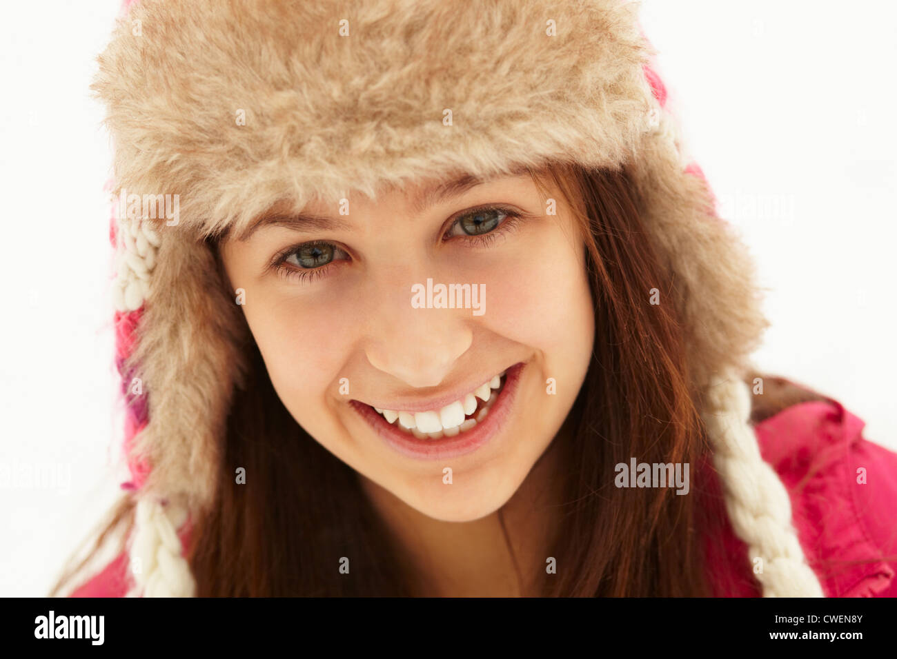 Portrait Of Teenage Girl In Snow Wearing Fur Hat Stock Photo - Alamy