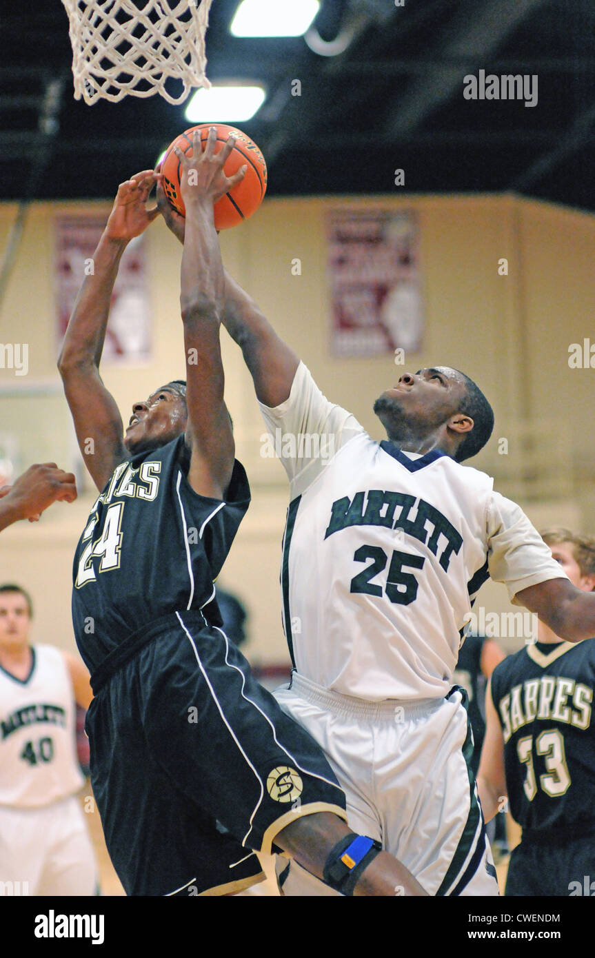 Basketball Players battle as they try to secure a offensive rebound ...