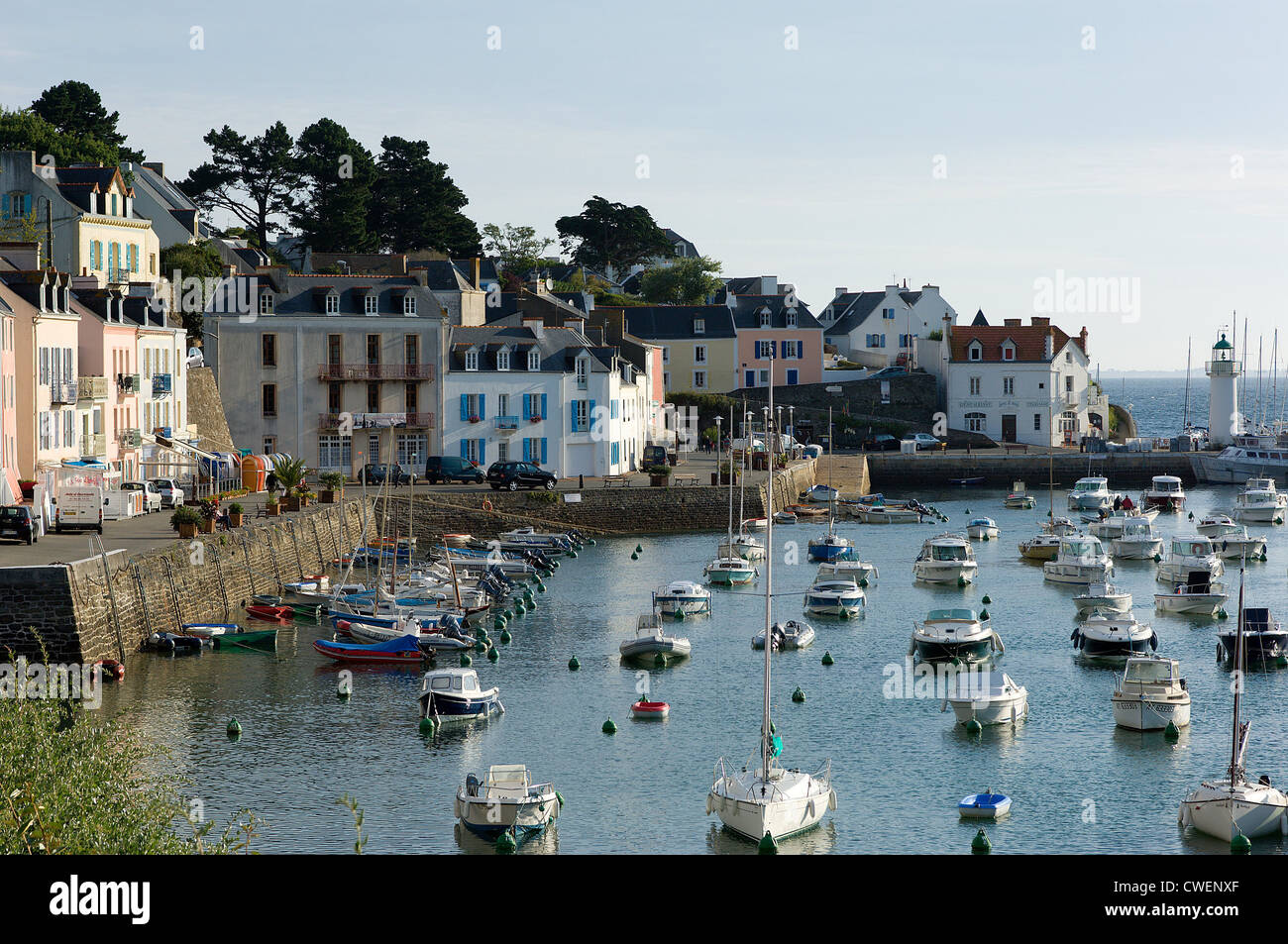 Boats sitting quietly at anchor in the little port of Sauzon on Belle ...
