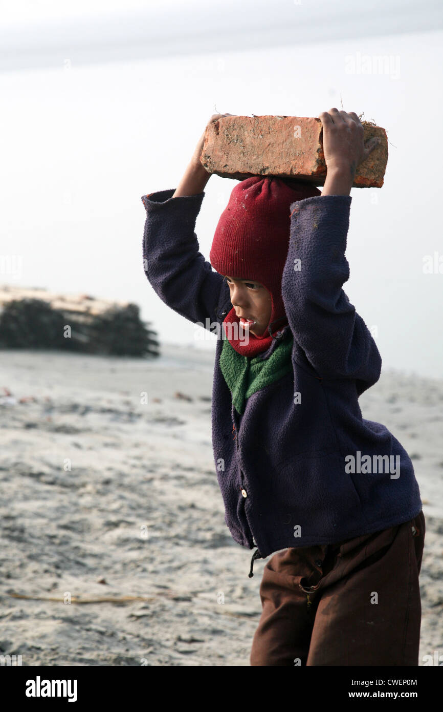 Child workers carry bricks carrying it on his head in Sonakhali, West ...