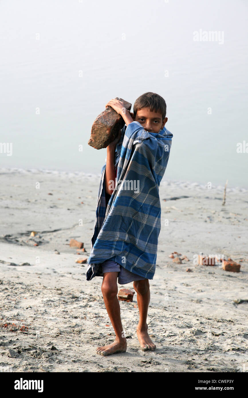 Man carrying heavy brick hi-res stock photography and images - Alamy