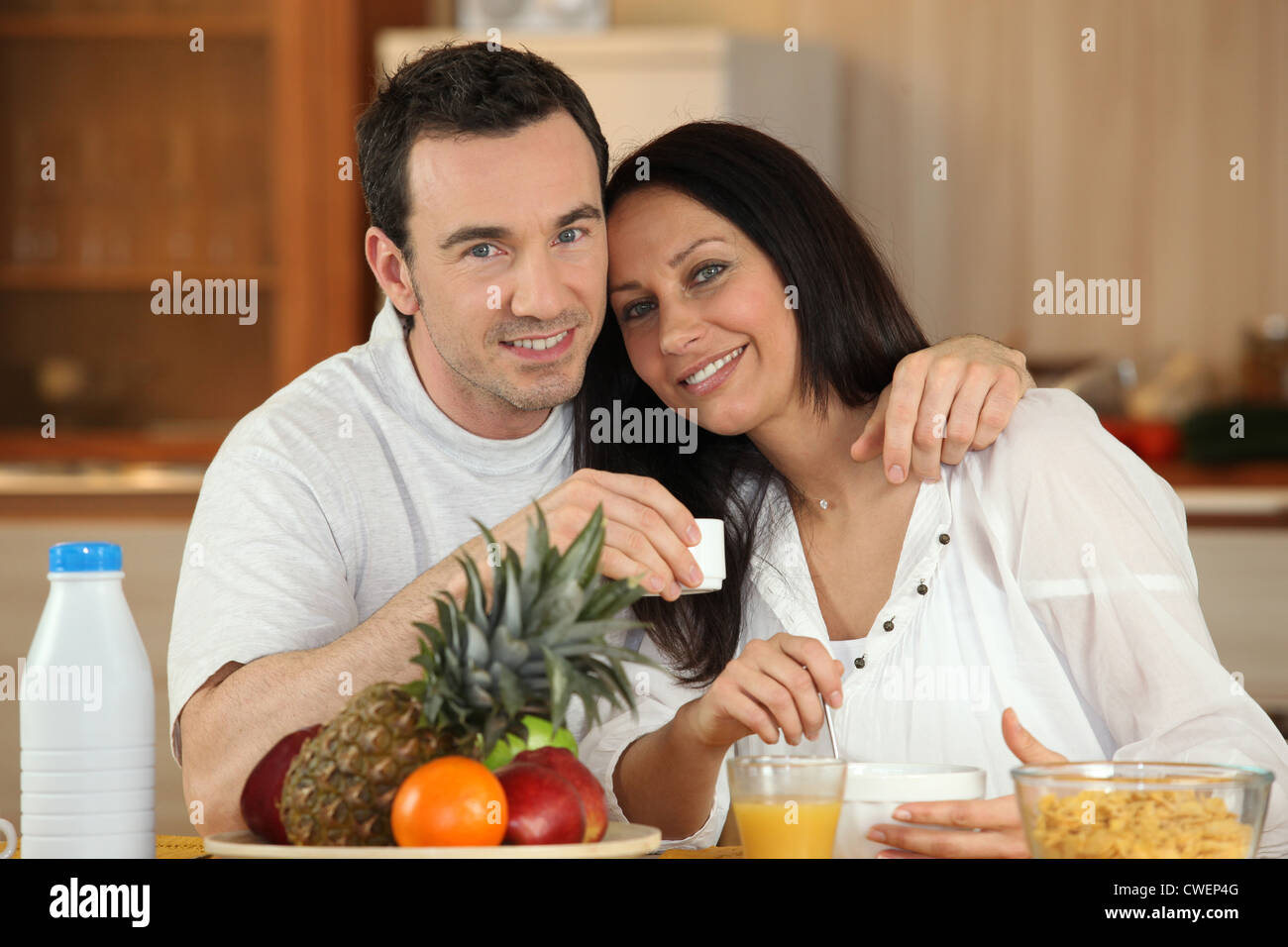 Couple having breakfast together Stock Photo - Alamy