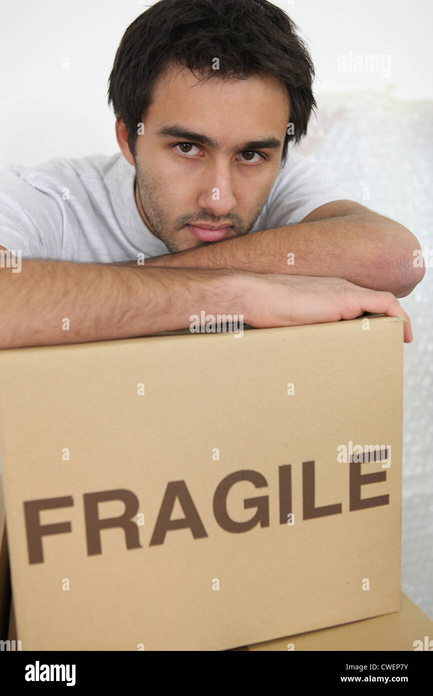A tired man on moving day Stock Photo - Alamy