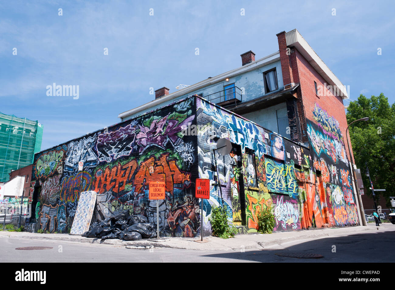 Graffiti covered building in downtown Montreal, province of Quebec ...