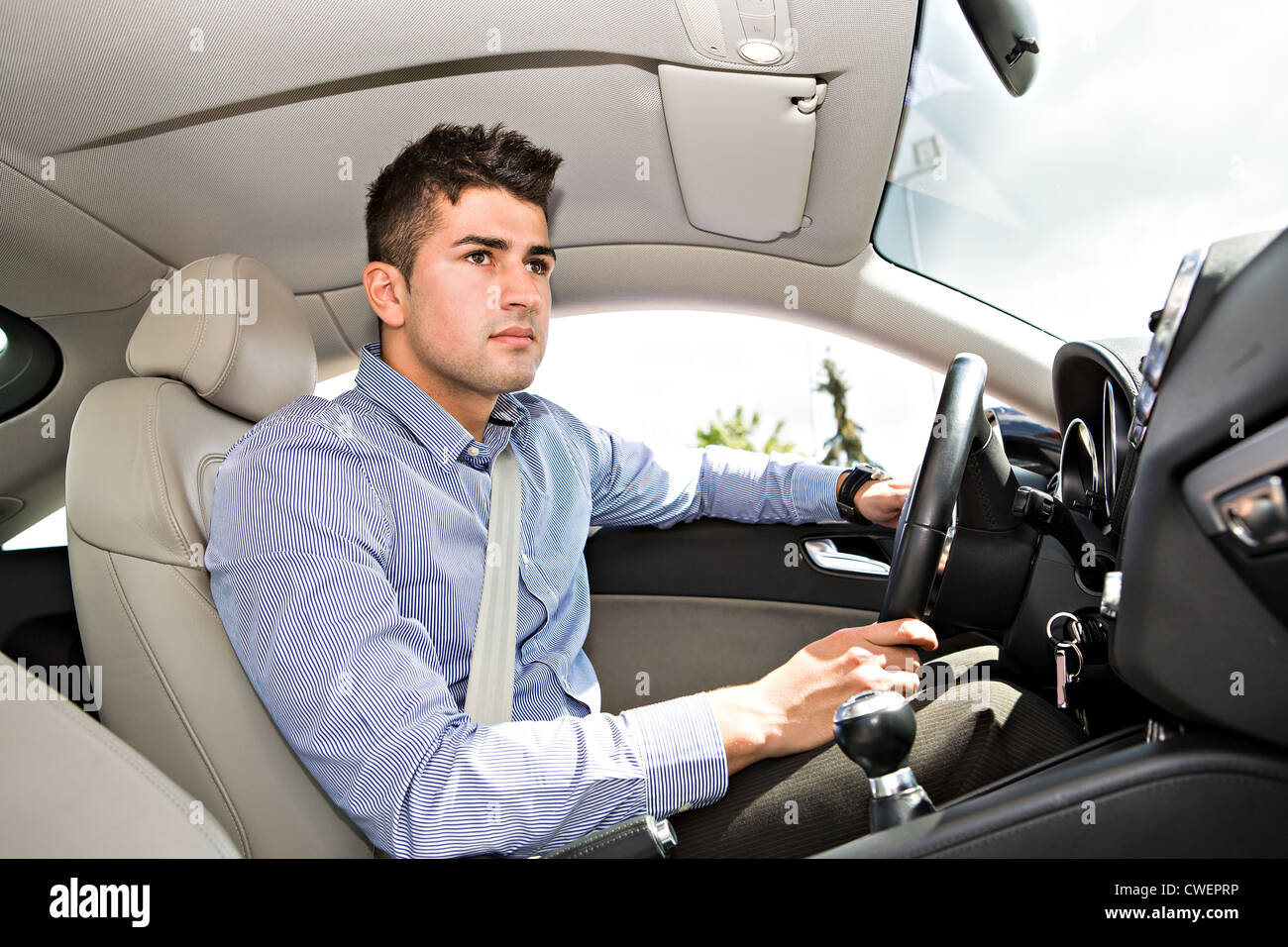 a young man driving the car Stock Photo - Alamy