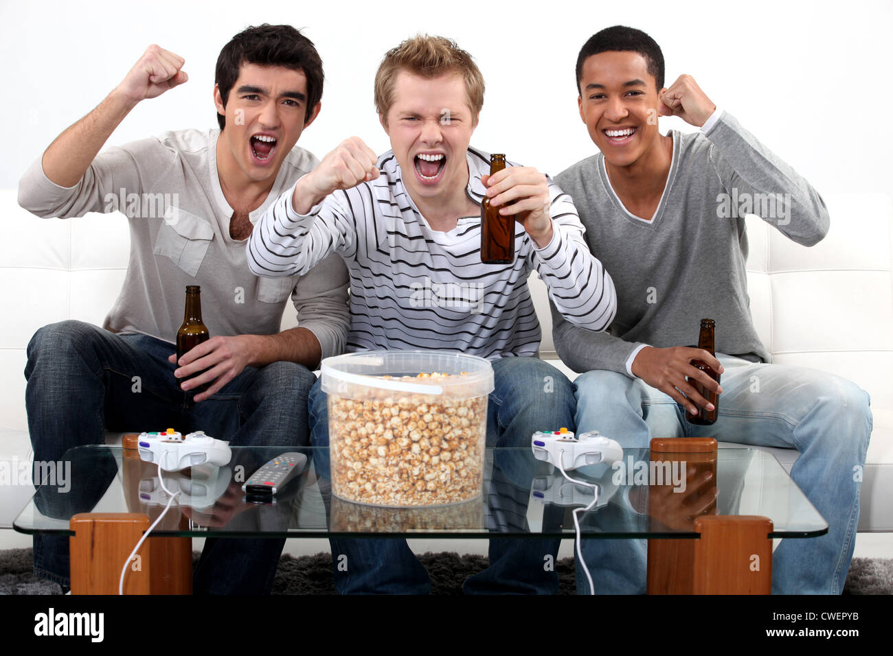three teenagers having a party at home Stock Photo - Alamy