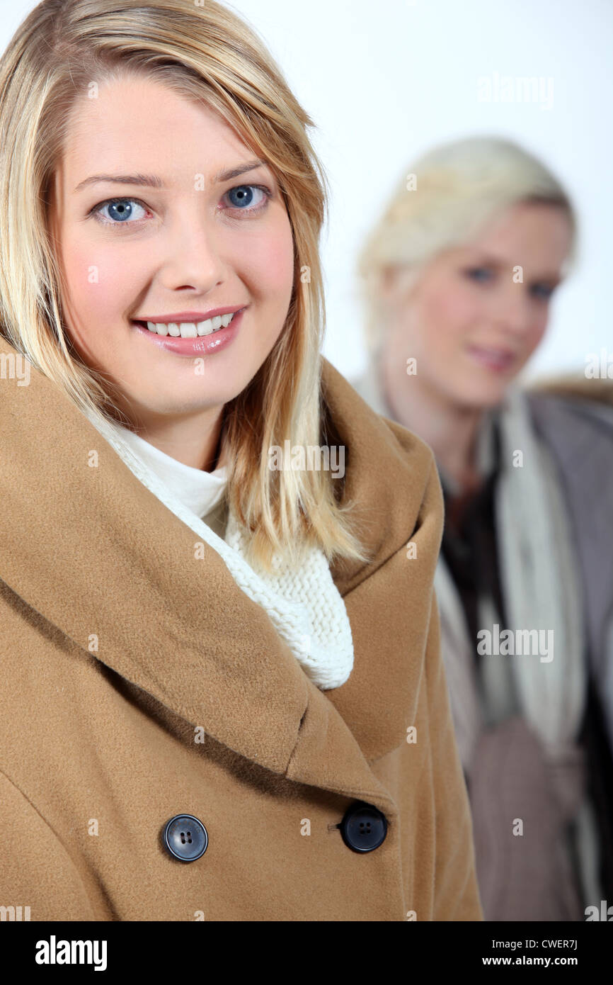 Two women dressed in winter clothing Stock Photo - Alamy