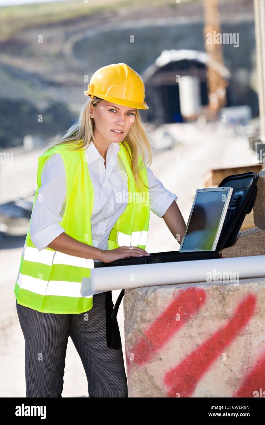 A young female constructor at building of a neu motorway in Germany ...