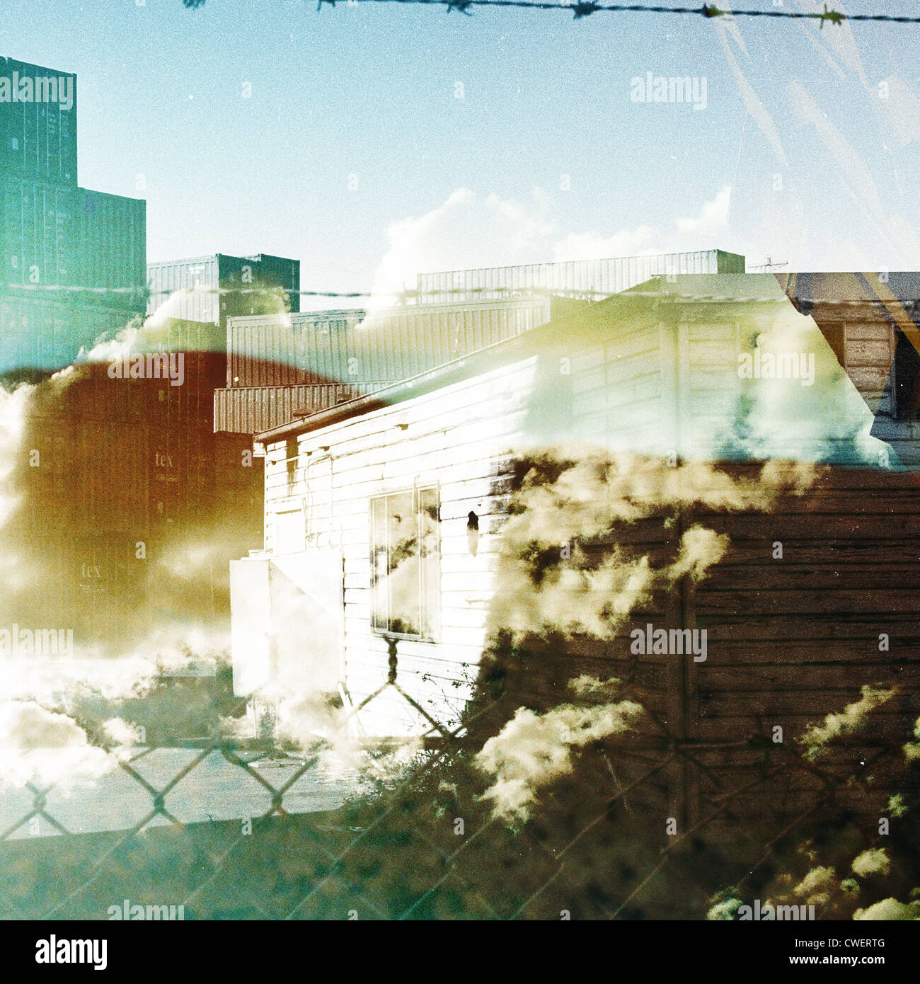 Double exposed shipping containers, chicken wire, clouds Stock Photo ...