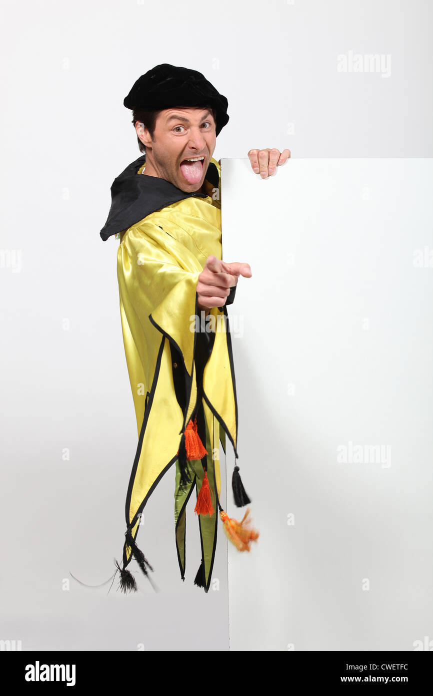 man dressed as a harlequin Stock Photo - Alamy