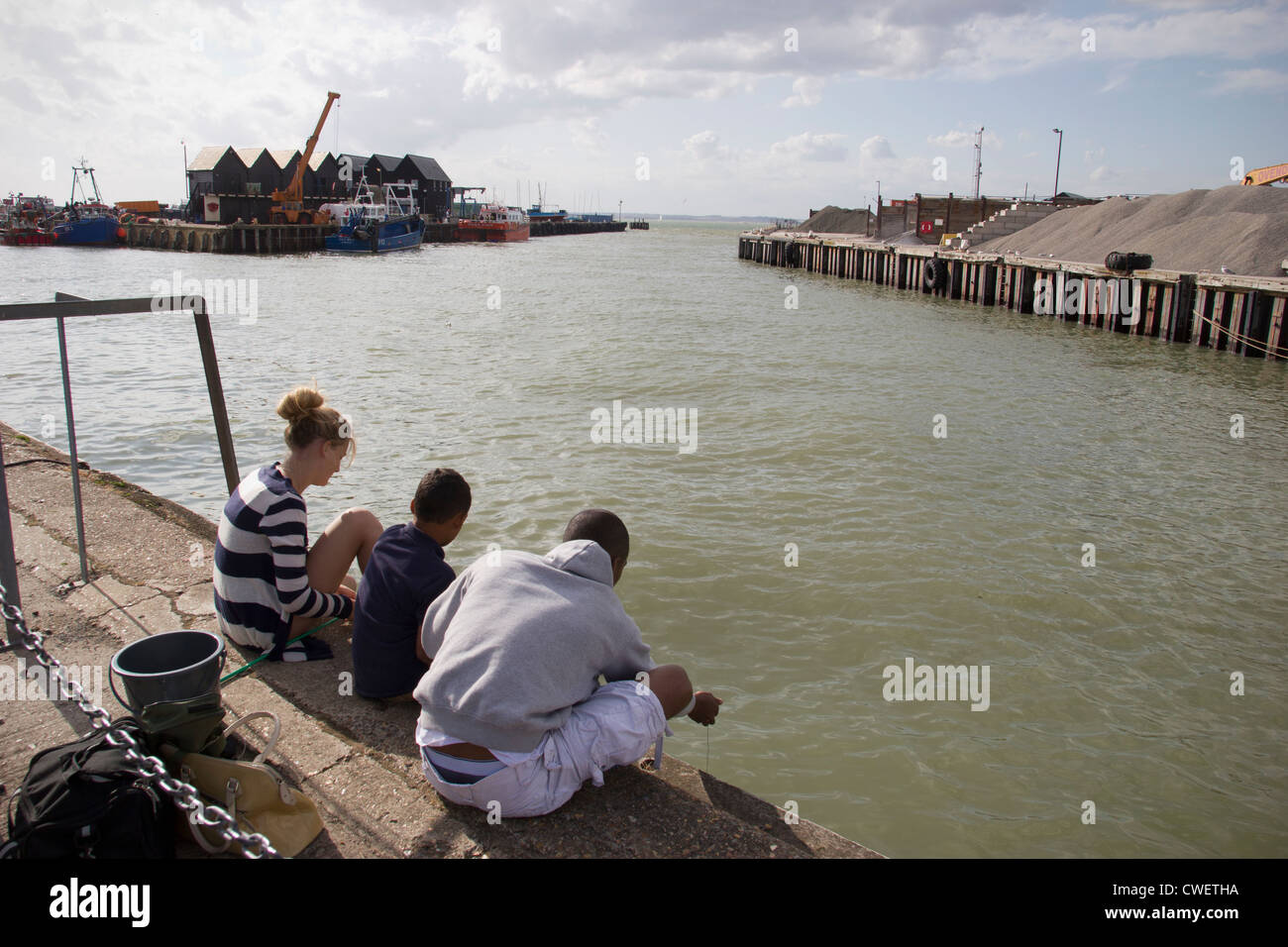 Family Crabbing Whitstable Harbour Kent England UK Stock Photo - Alamy