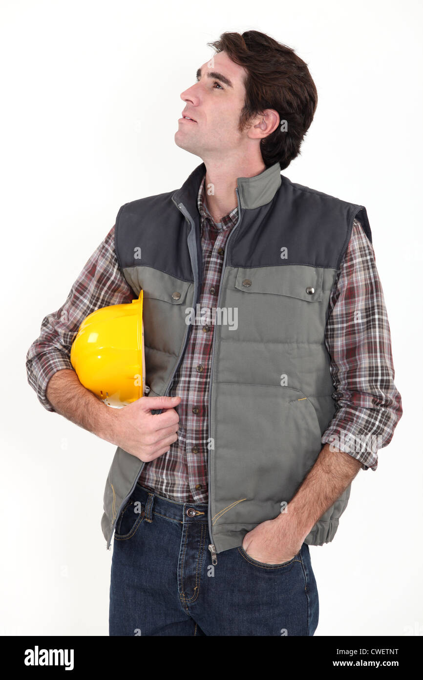 Construction worker staring off into space Stock Photo - Alamy
