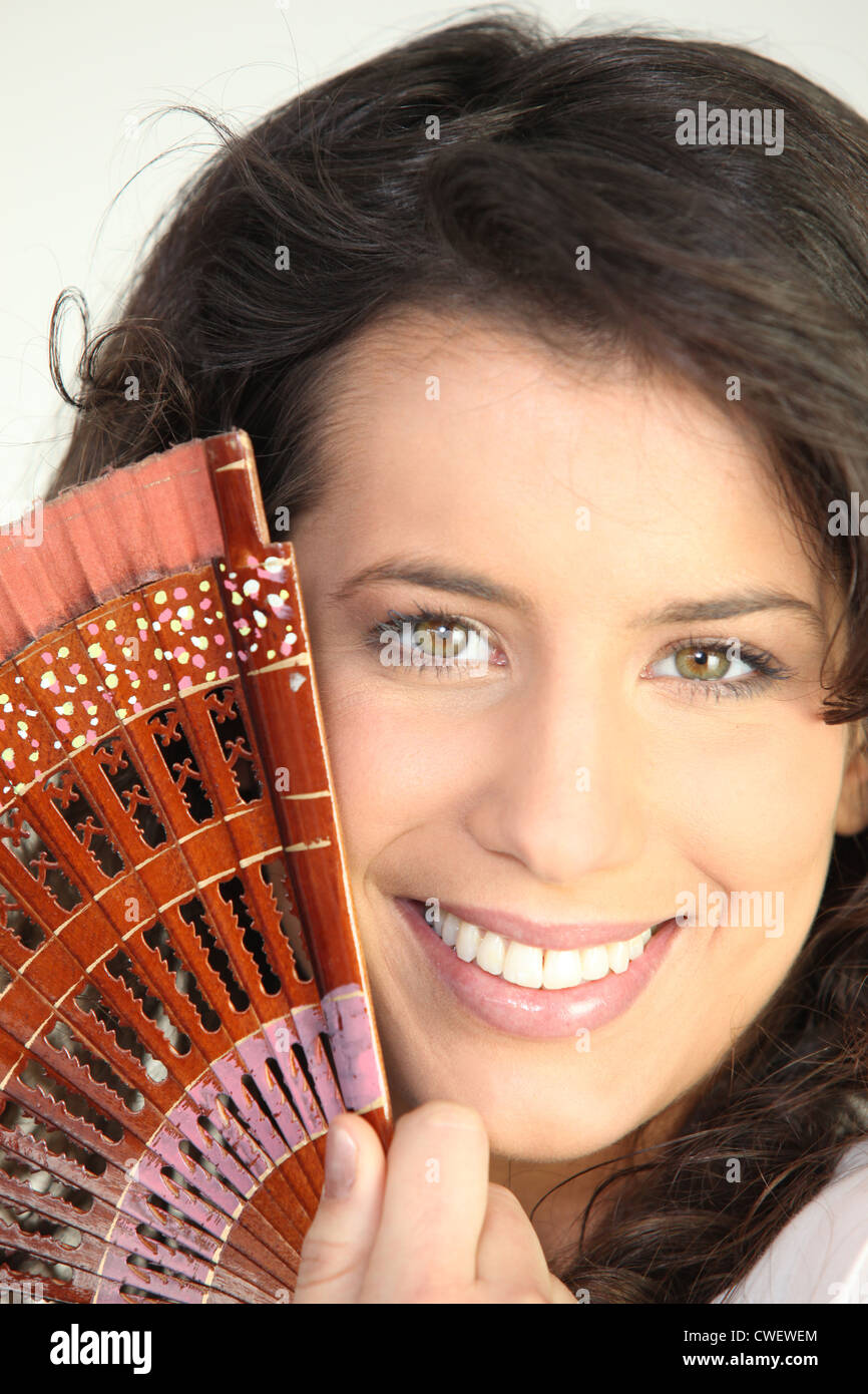 Portrait of woman with fan Stock Photo - Alamy