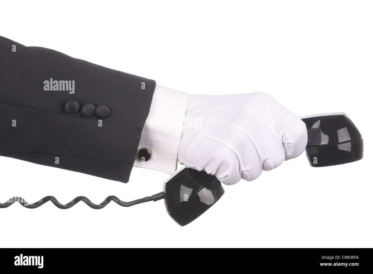 Butler holding and antique rotary dial telephone receiver in ...