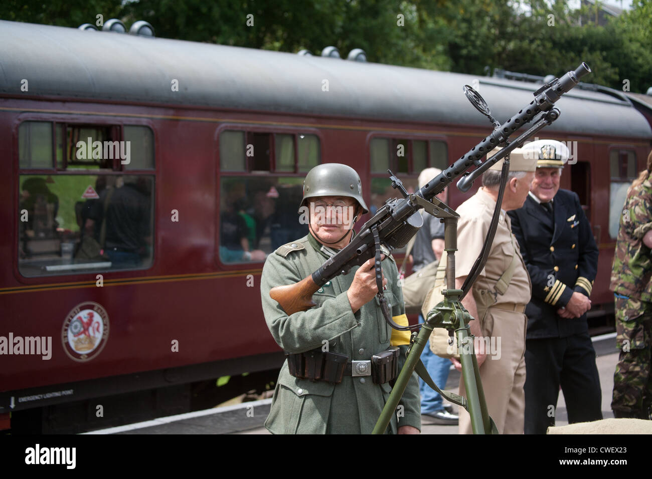 German soldier on railway platform with heavy machine gun Stock Photo ...