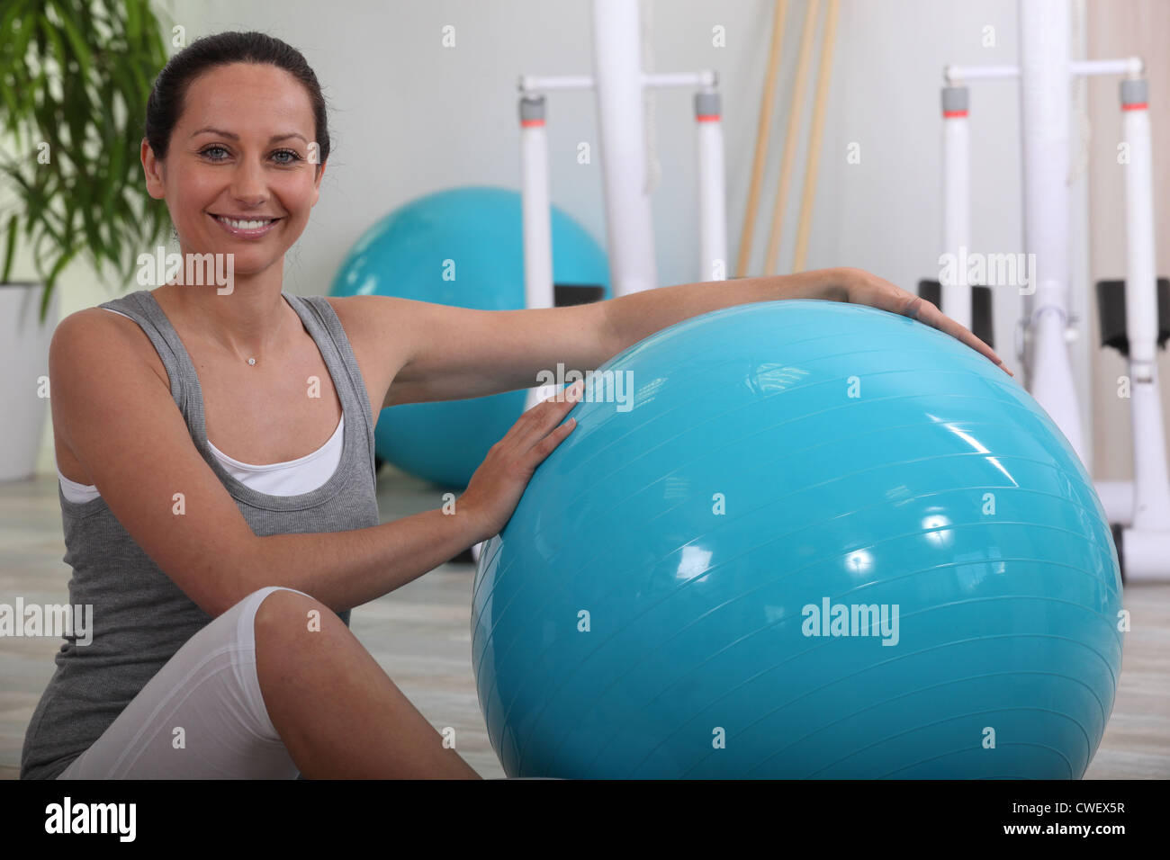 Woman with blue ball Stock Photo - Alamy