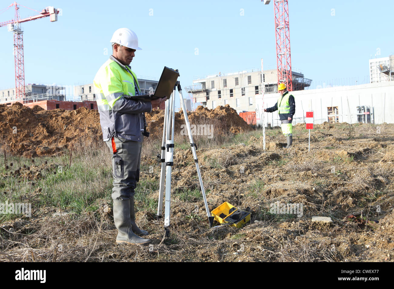Surveyor on site with a laptop Stock Photo - Alamy