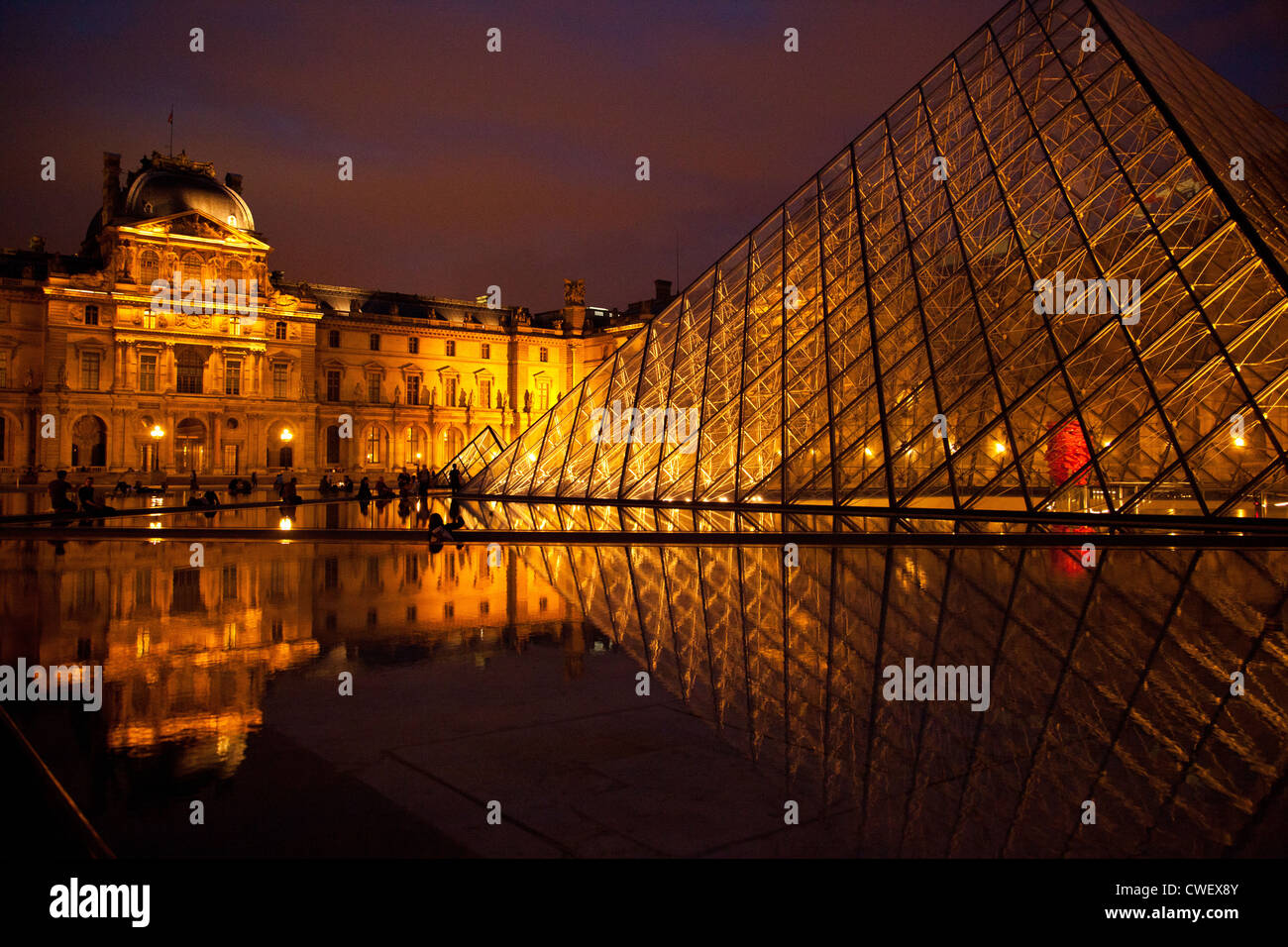 The glass pyramid in Cour Napoleon with the Louvre in the background on ...