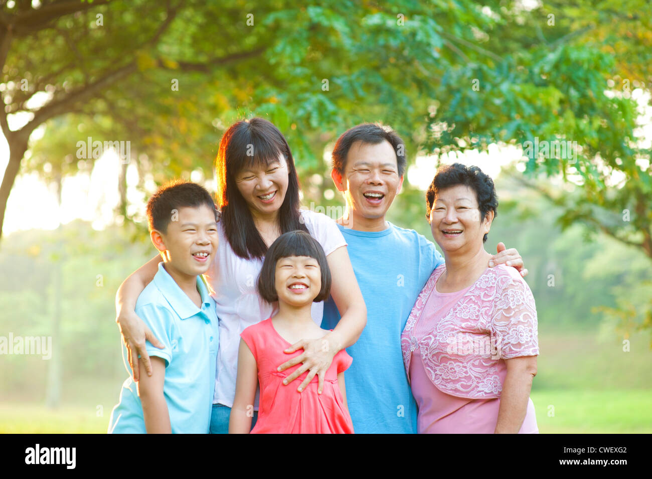 Happy outdoor family having great smile Stock Photo - Alamy