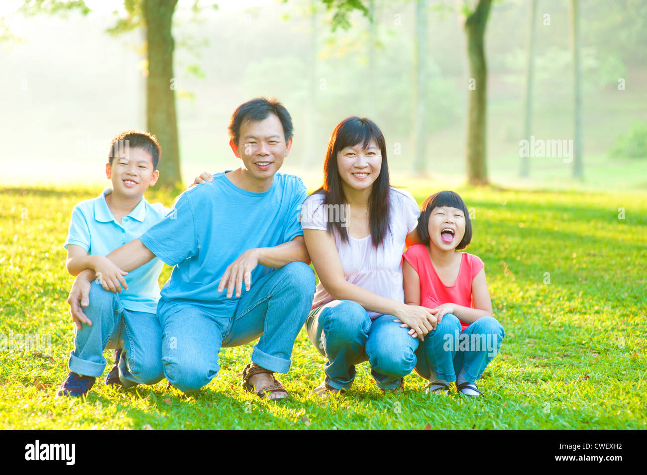 Happy Asian family in the park Stock Photo - Alamy