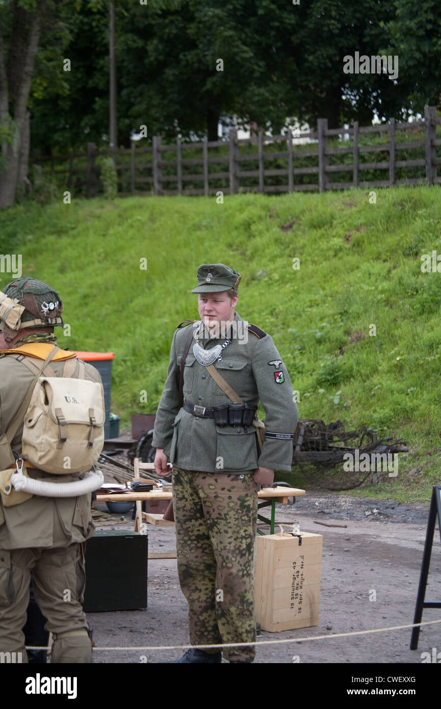 German field police officer with smile talking to American soldier ...
