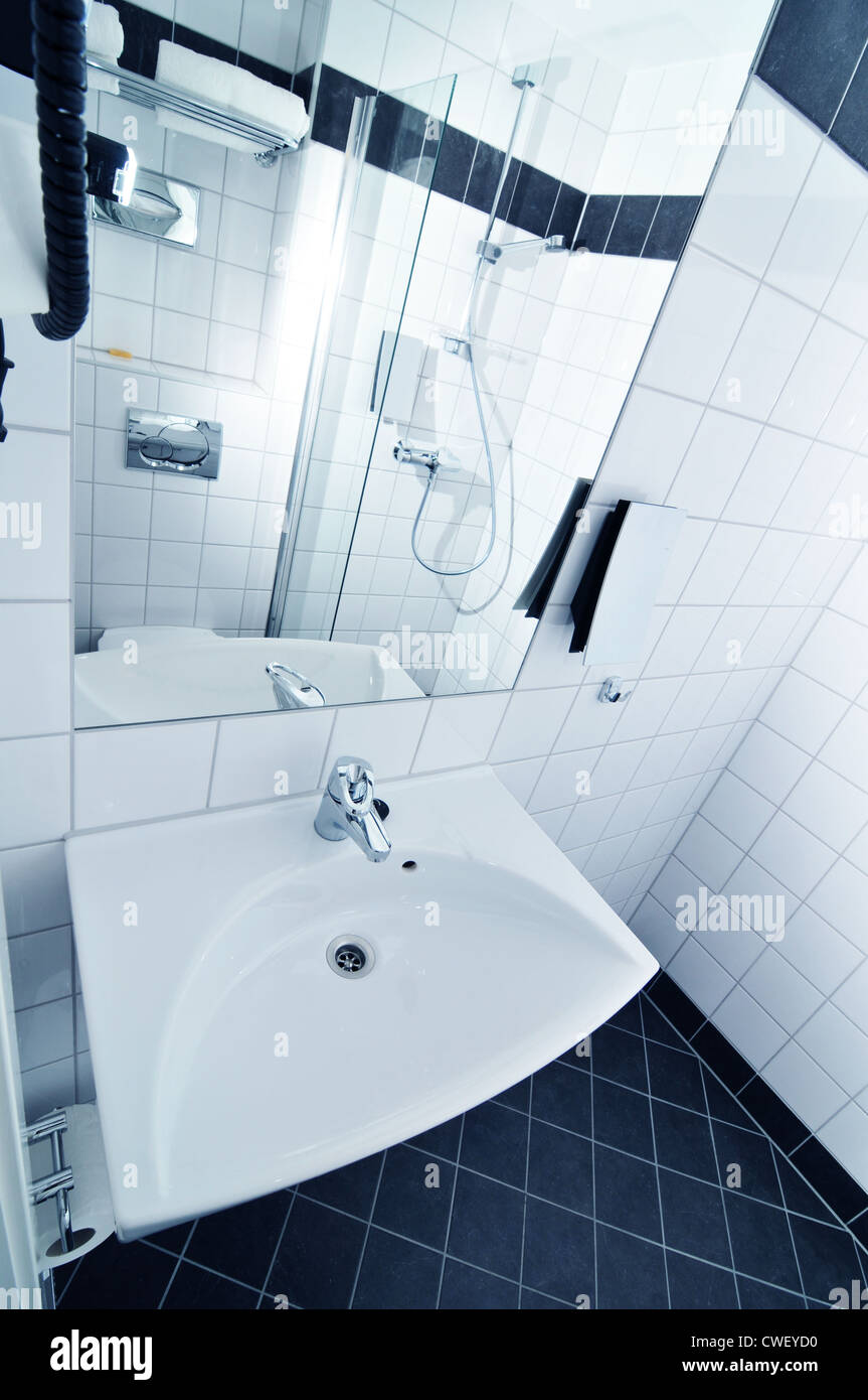 Wide angle perspective of hotel bathroom with sink and shower Stock ...