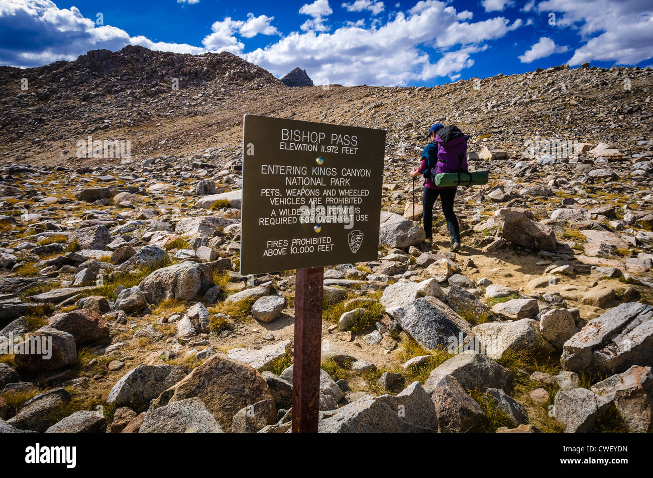 Bishop Pass trail entrance sign and backpacker, Kings Canyon National ...