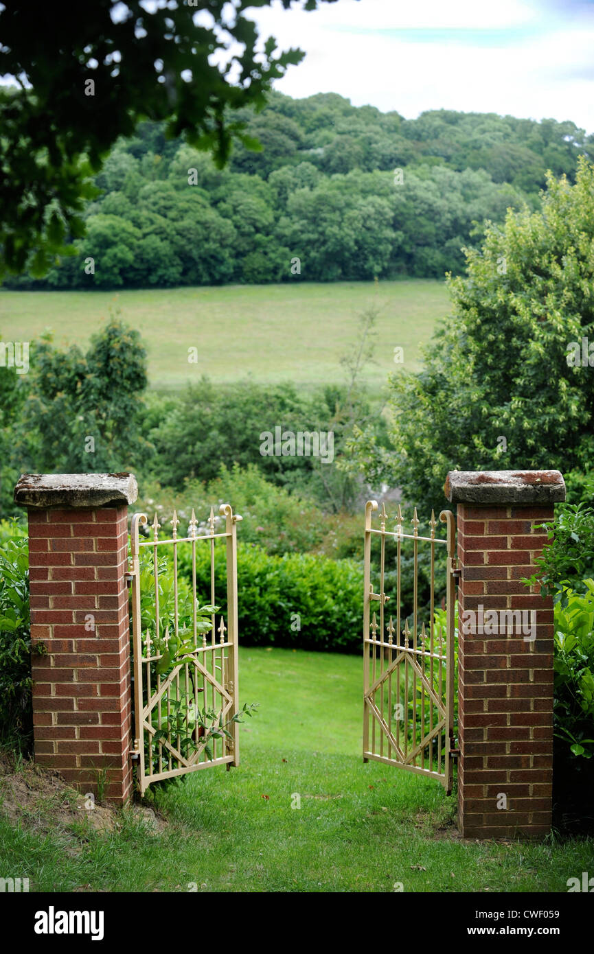 A gateway from a garden into open countryside England UK Stock Photo ...