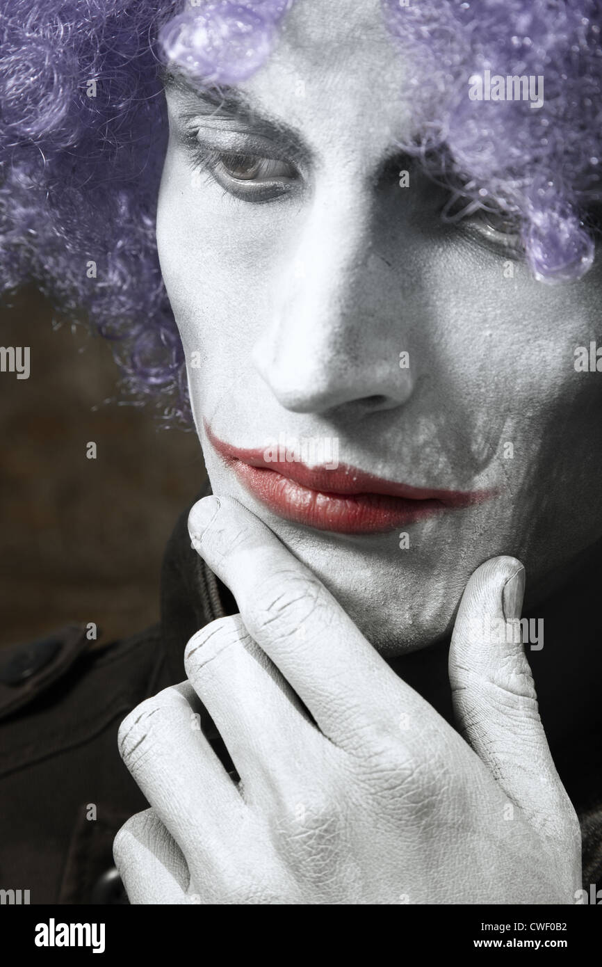 Single sad funny man with theatrical makeup and wig. Vertical photo ...