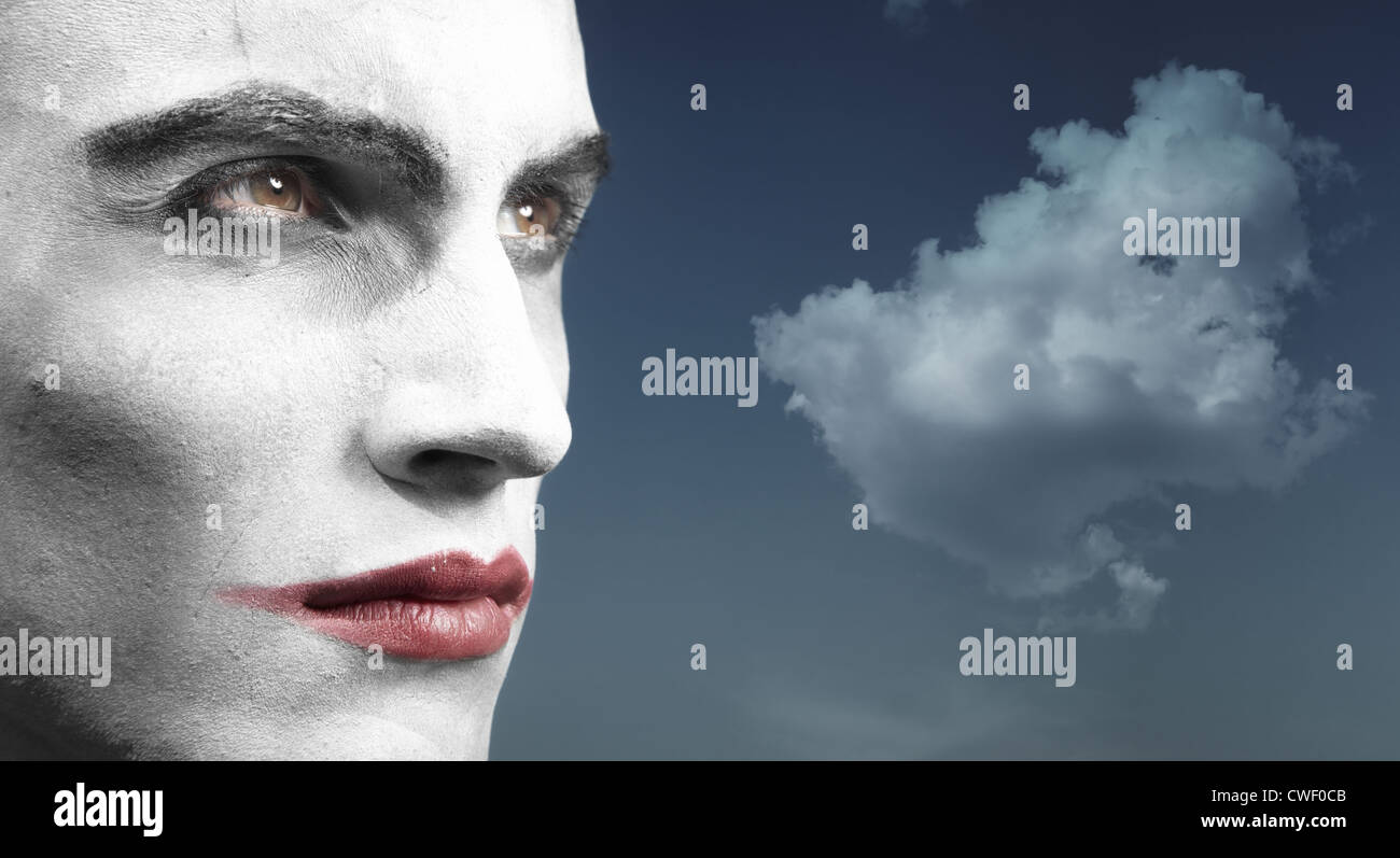 Headshot of the vampire outdoors and cloud on the background. Artistic ...