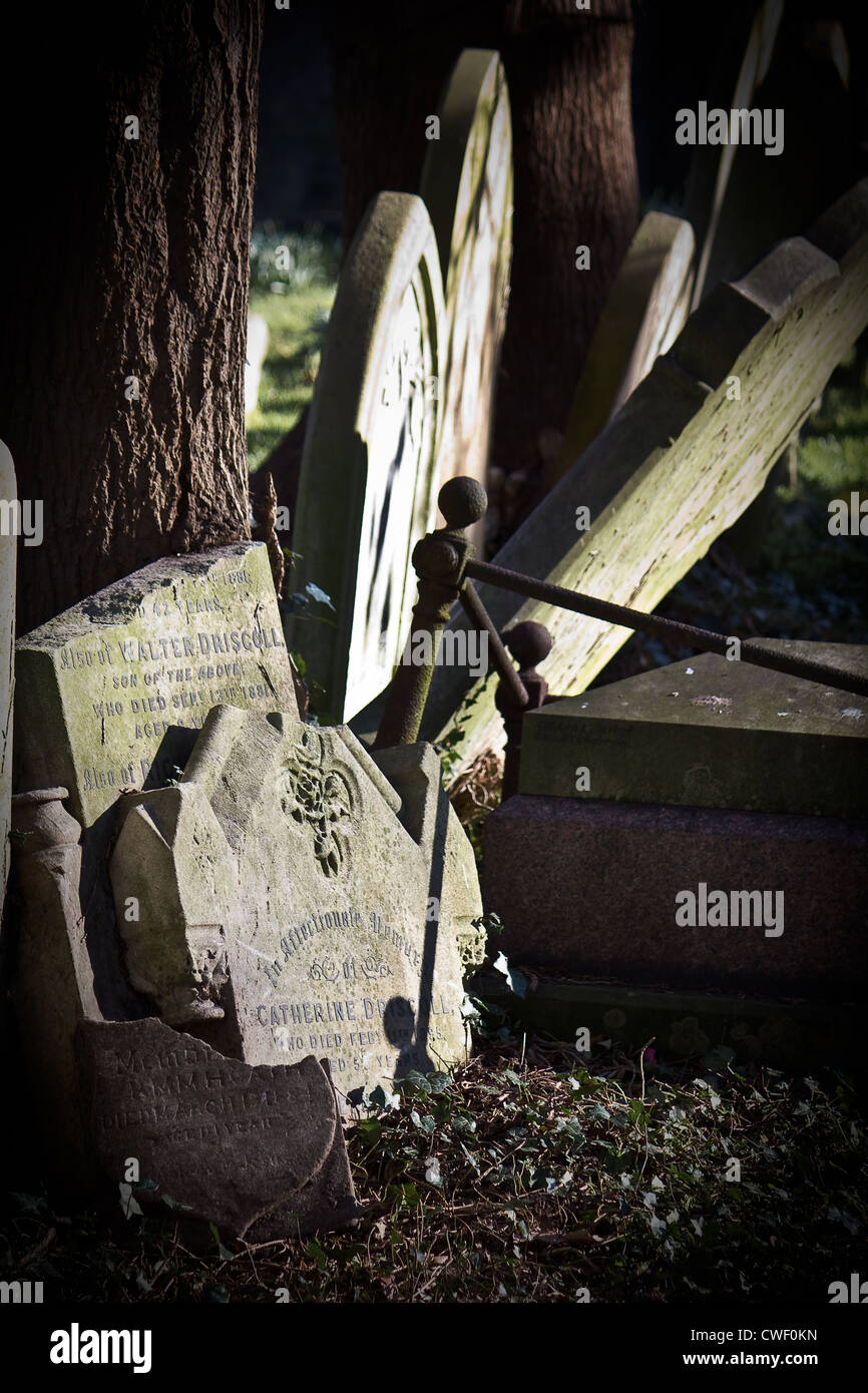 Broken old headstones in a graveyard Stock Photo - Alamy