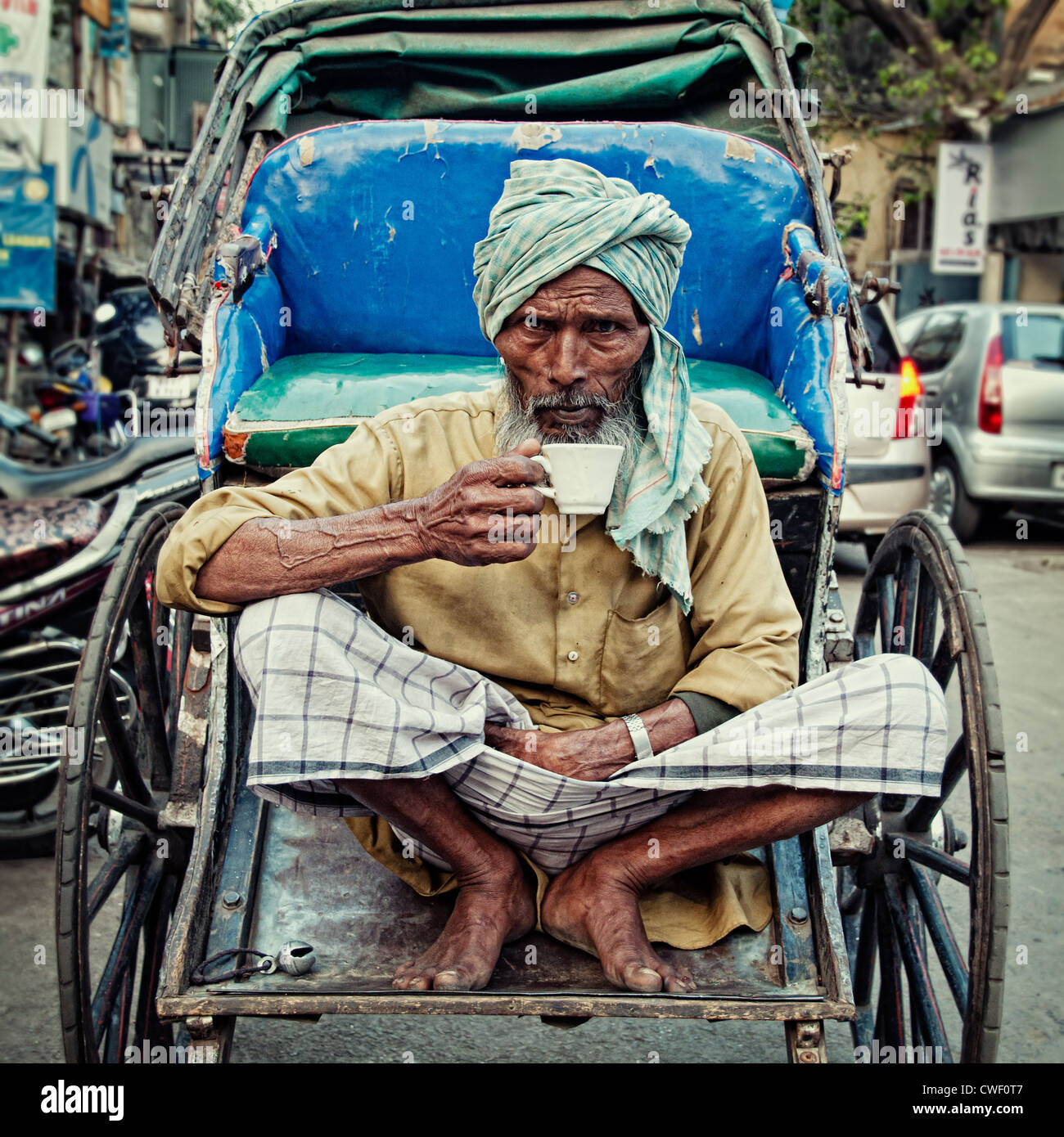Rickshaw wallah taking a cup of indian tea on his rickshaw. Calcutta ...