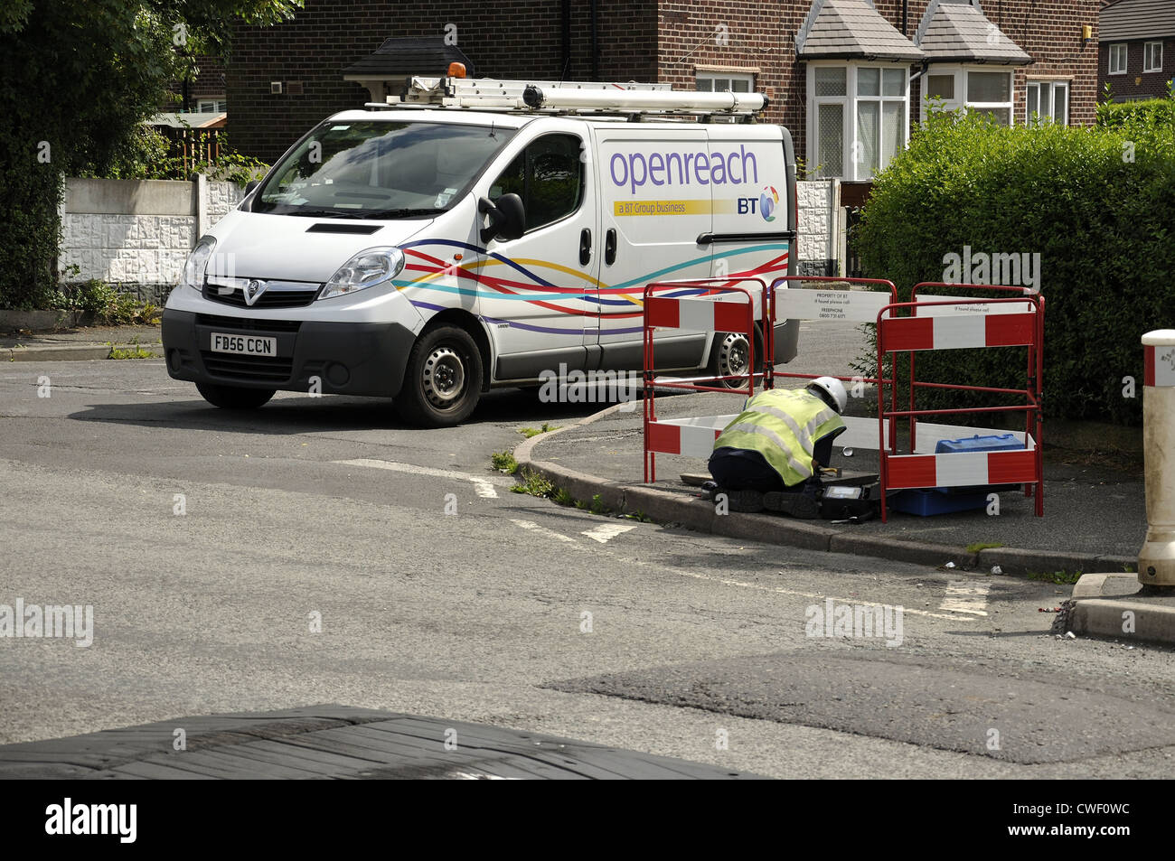 British Telecom engineer working on underground equipment with hazard ... British Telecom engineer working on underground equipment with hazard ...