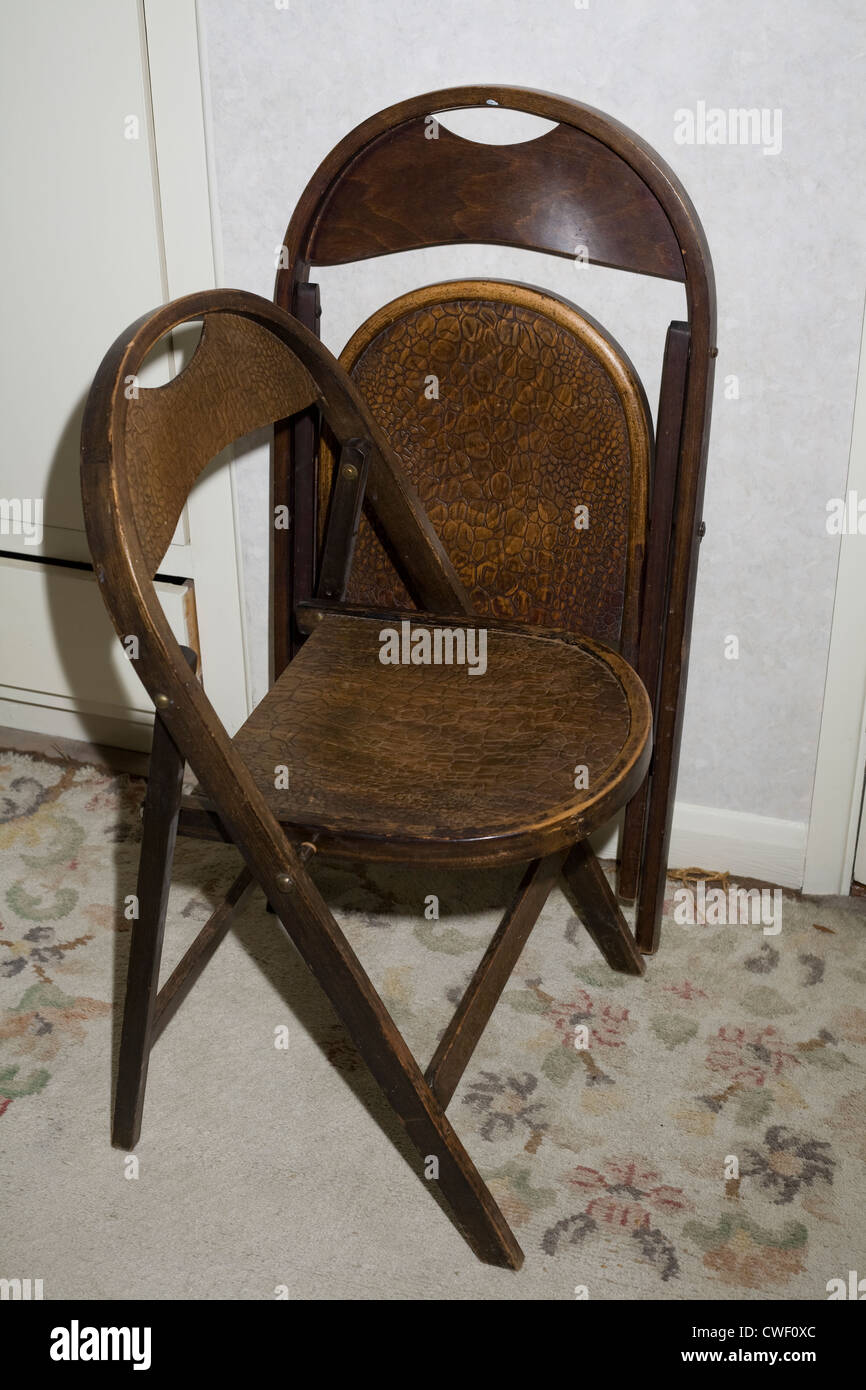 two folding collapsible portable wooden chairs Stock Photo - Alamy