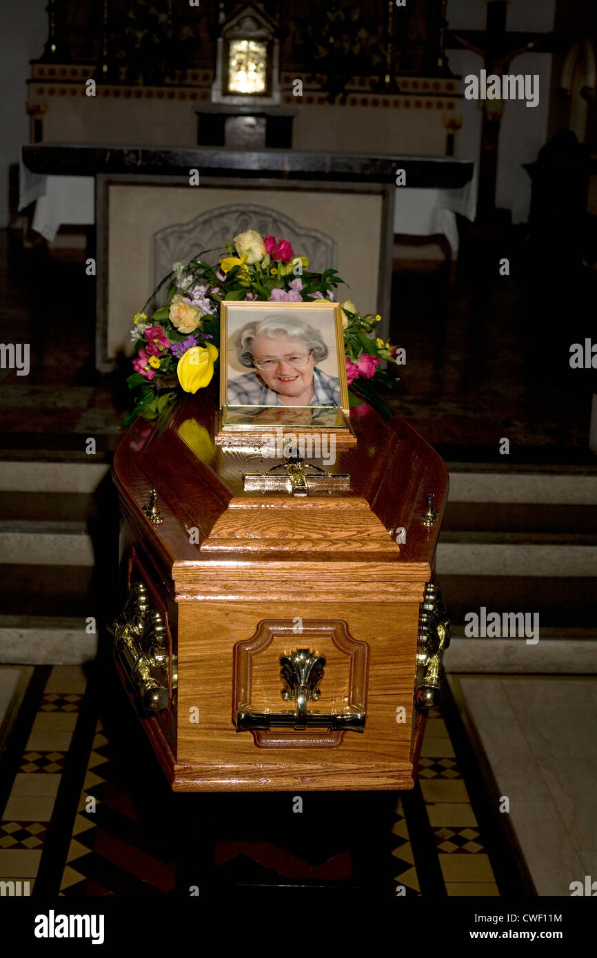 coffin for the lady who has died has arrived in church to rest ...