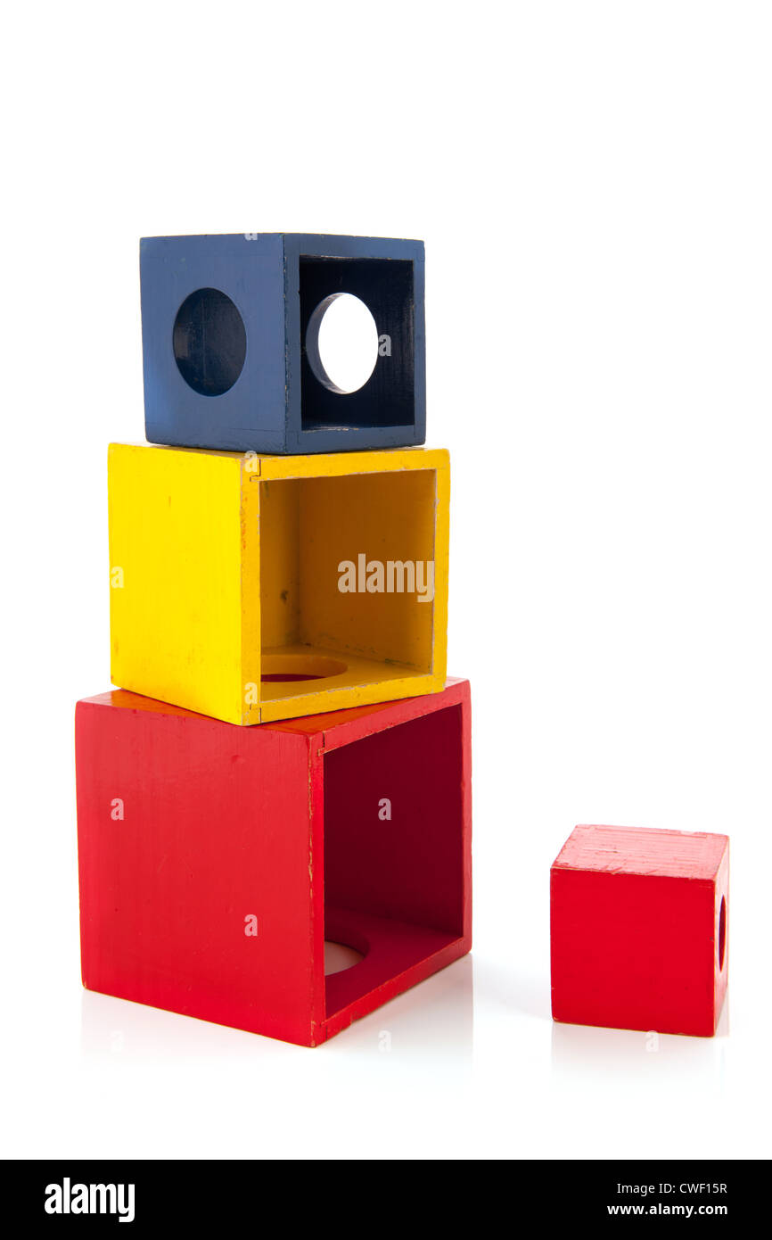 Stacked wooden toy blocks isolated over white background Stock Photo ...