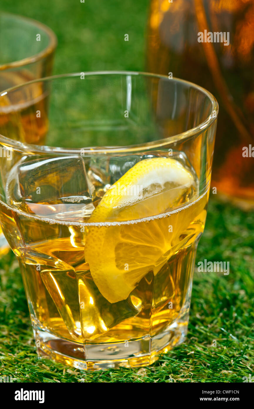 Iced Lemon Ice Tea in on a lawn in summer Stock Photo - Alamy