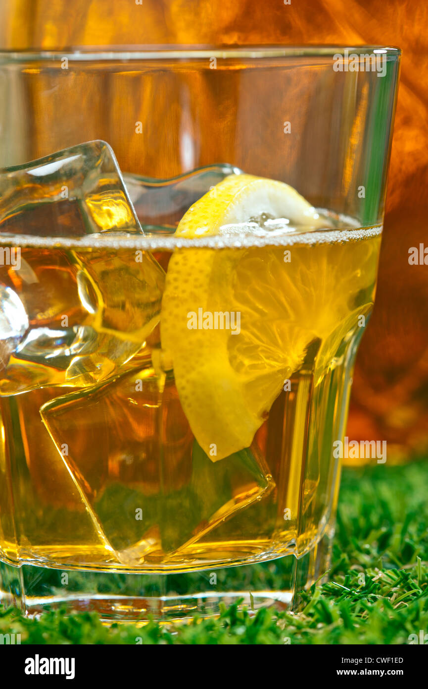 Iced Lemon Ice Tea in on a lawn in summer Stock Photo - Alamy