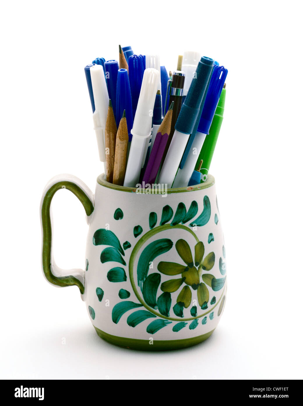 Assorted pencils and ballpoint pens in coffee mug Stock Photo - Alamy