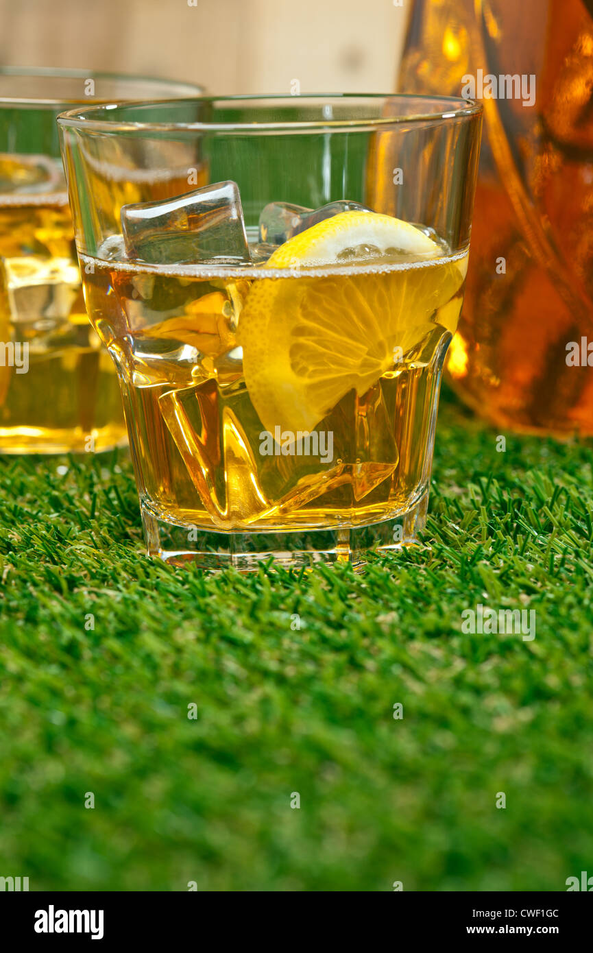 Iced Lemon Ice Tea in on a lawn in summer Stock Photo - Alamy