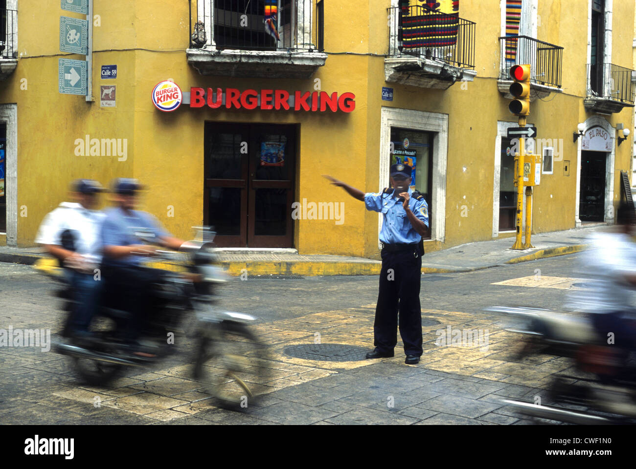 Policeman directing traffic on the busy streets of Merida, Yucatan ...