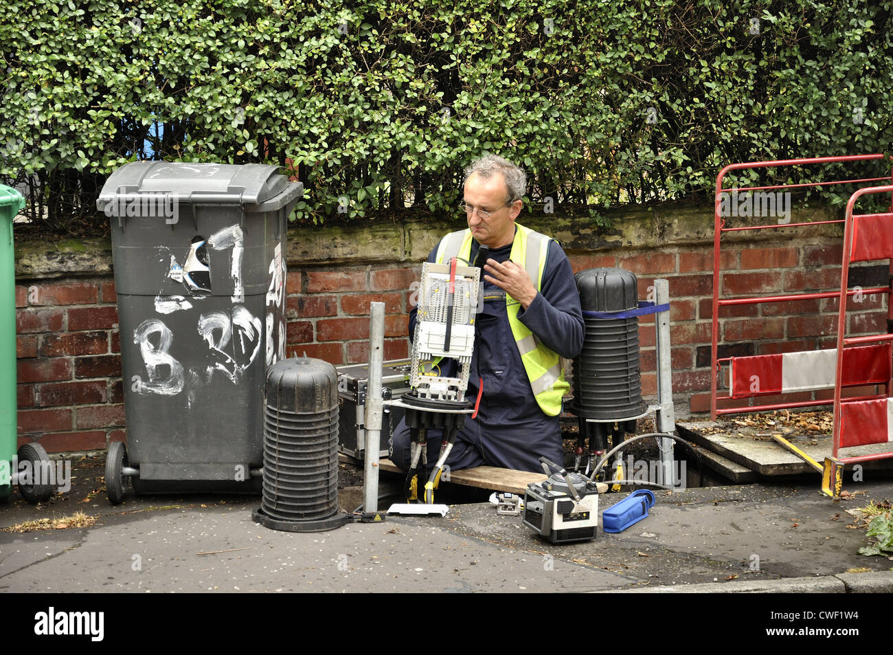 BT engineer working on underground equipment Stock Photo - Alamy