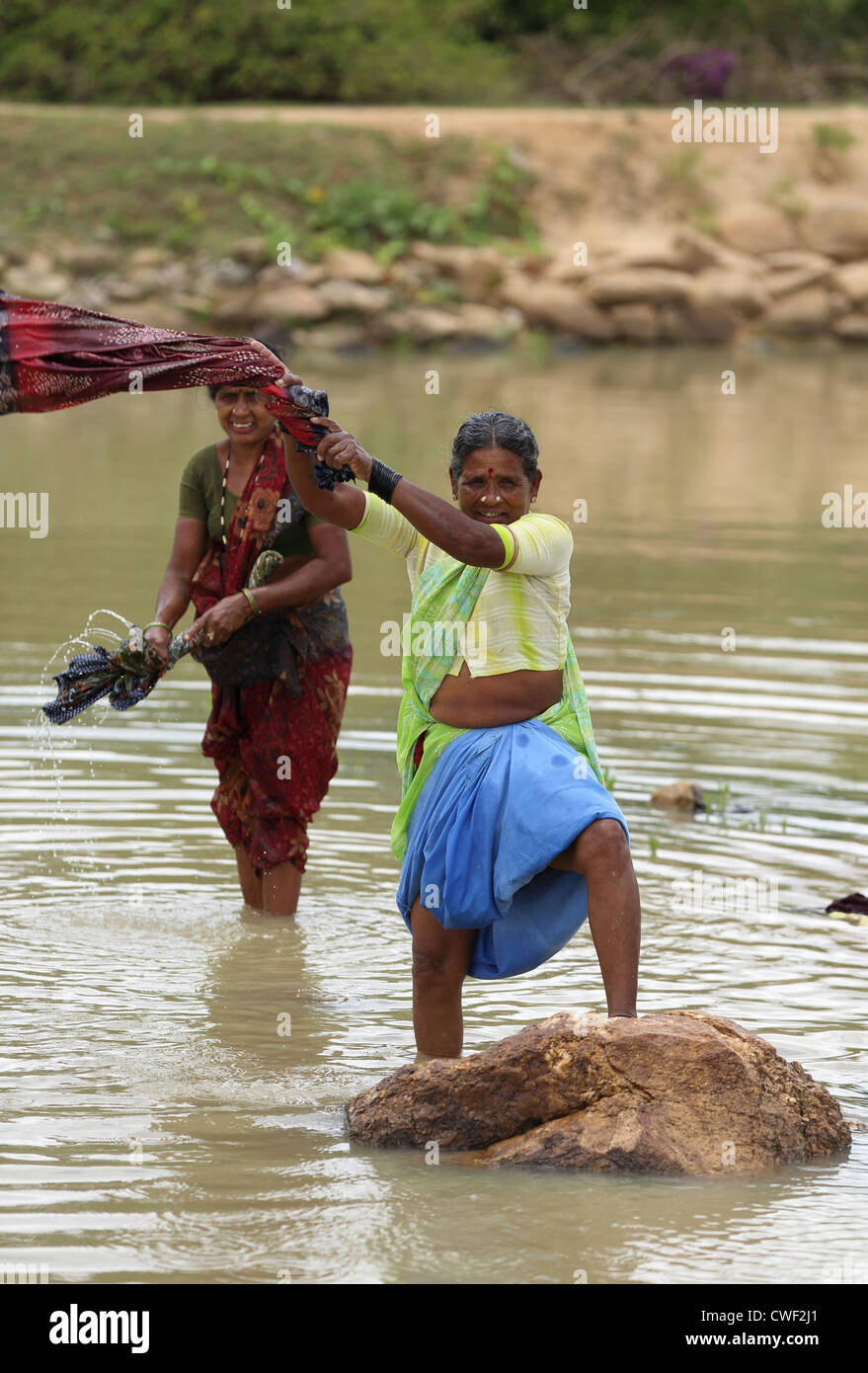 Rural Indian woman doing heir laundry Andhra Pradesh South India Stock ...