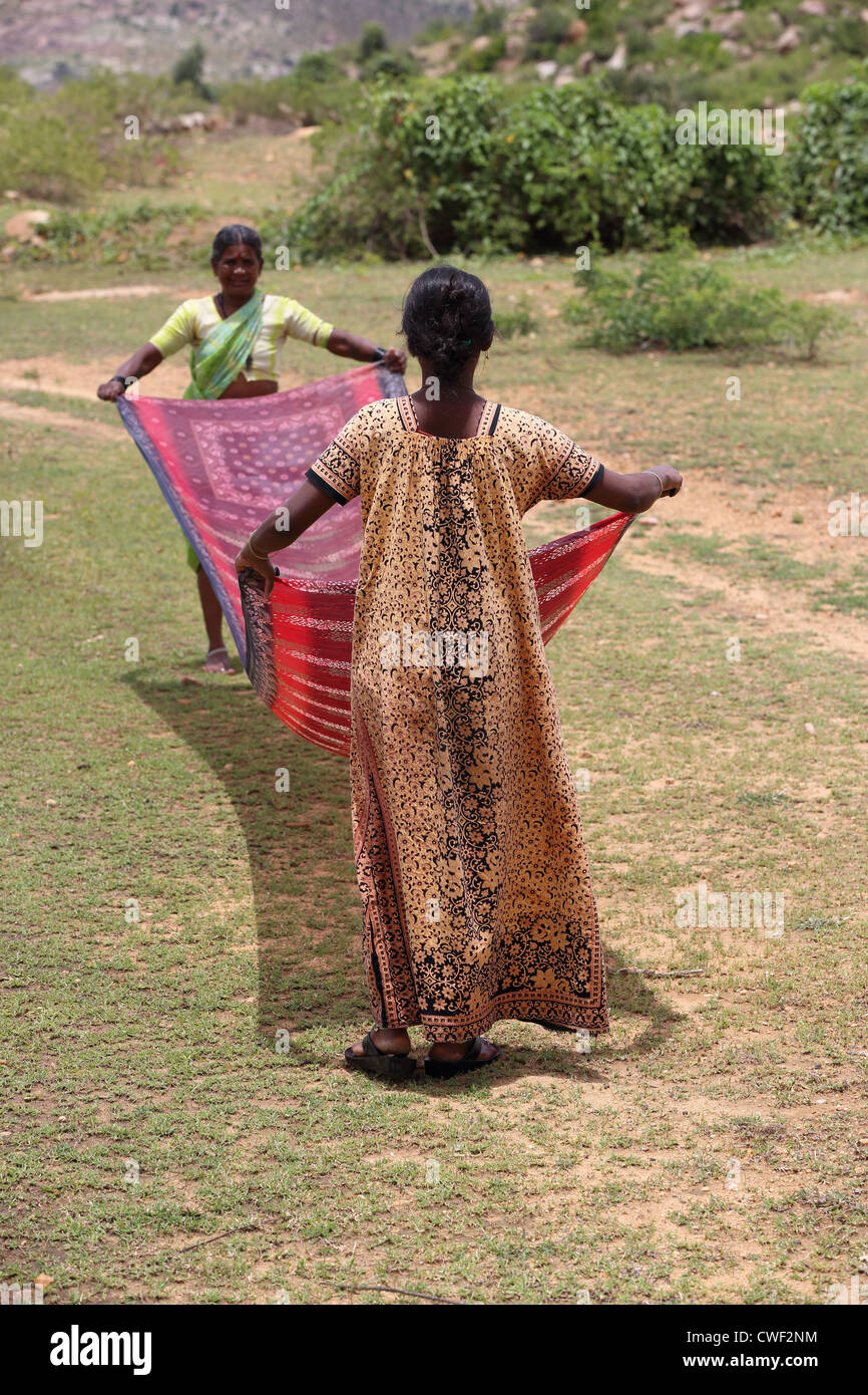 Rural Indian woman doing heir laundry Andhra Pradesh South India Stock ...